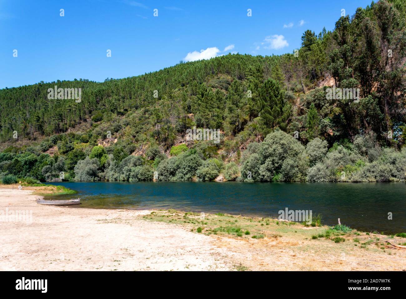 River beach in a valley surrounded by trees Stock Photo - Alamy