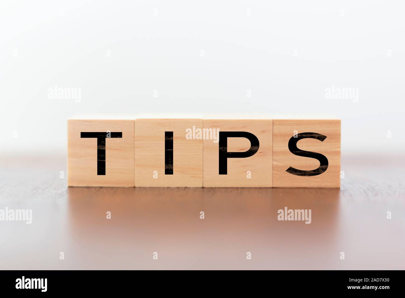 Tips word written on wooden cubes Stock Photo - Alamy