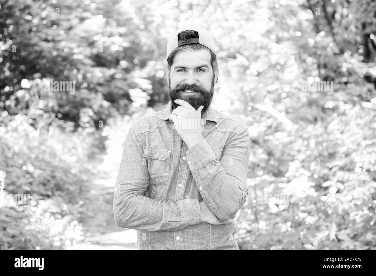 Eco activist. Man handsome bearded guy in sunny forest. United with ... Eco activist. Man handsome bearded guy in sunny forest. United with ...