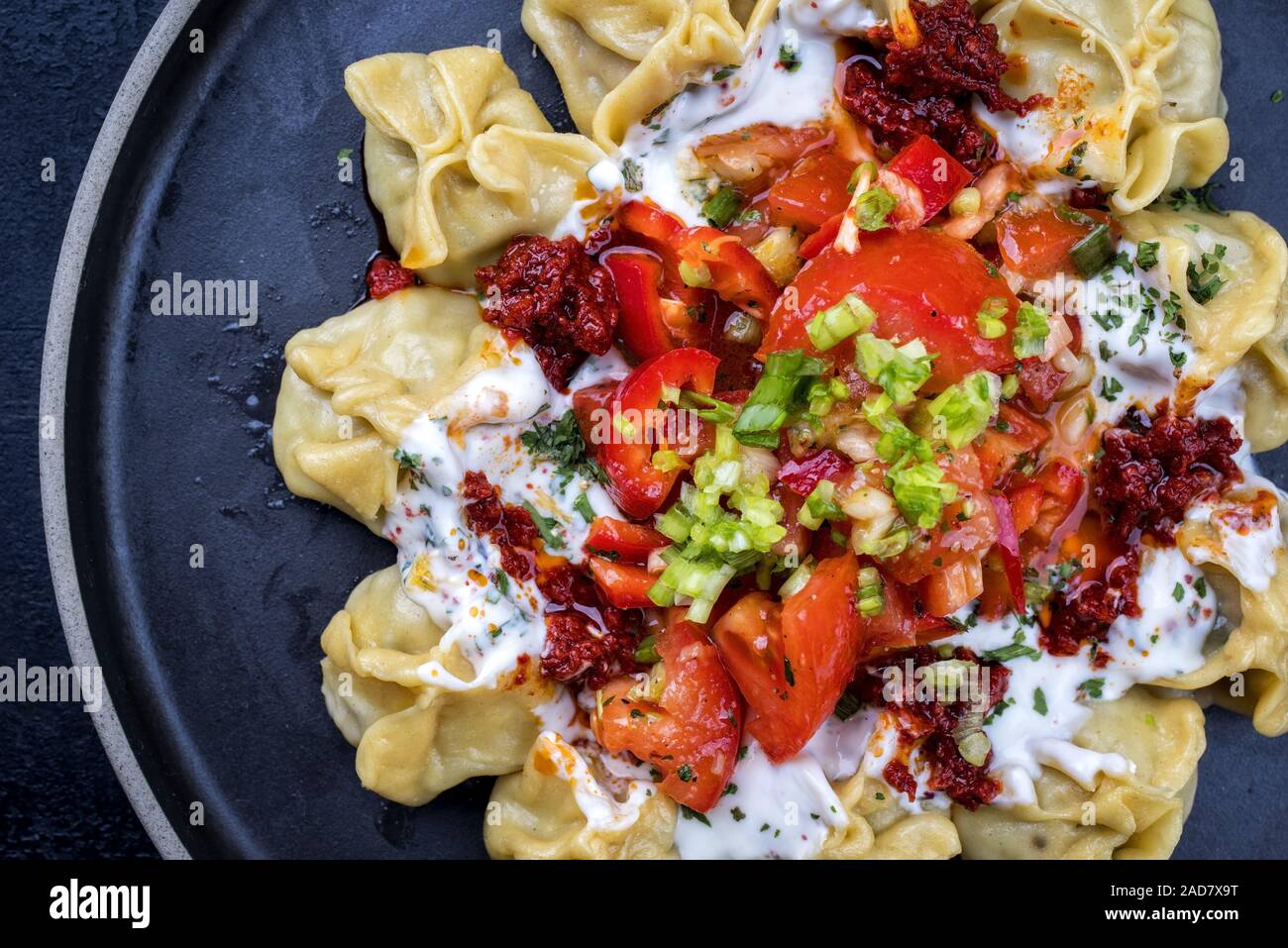 Traditional Turk manti steamed with mincemeat and paprika tomato salad ...