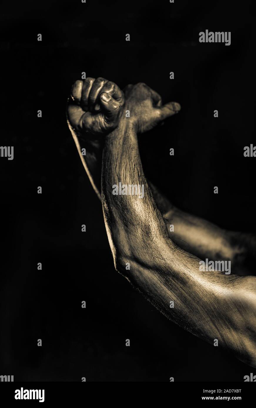 Close-up of a mans arm. Low key shoot Stock Photo - Alamy