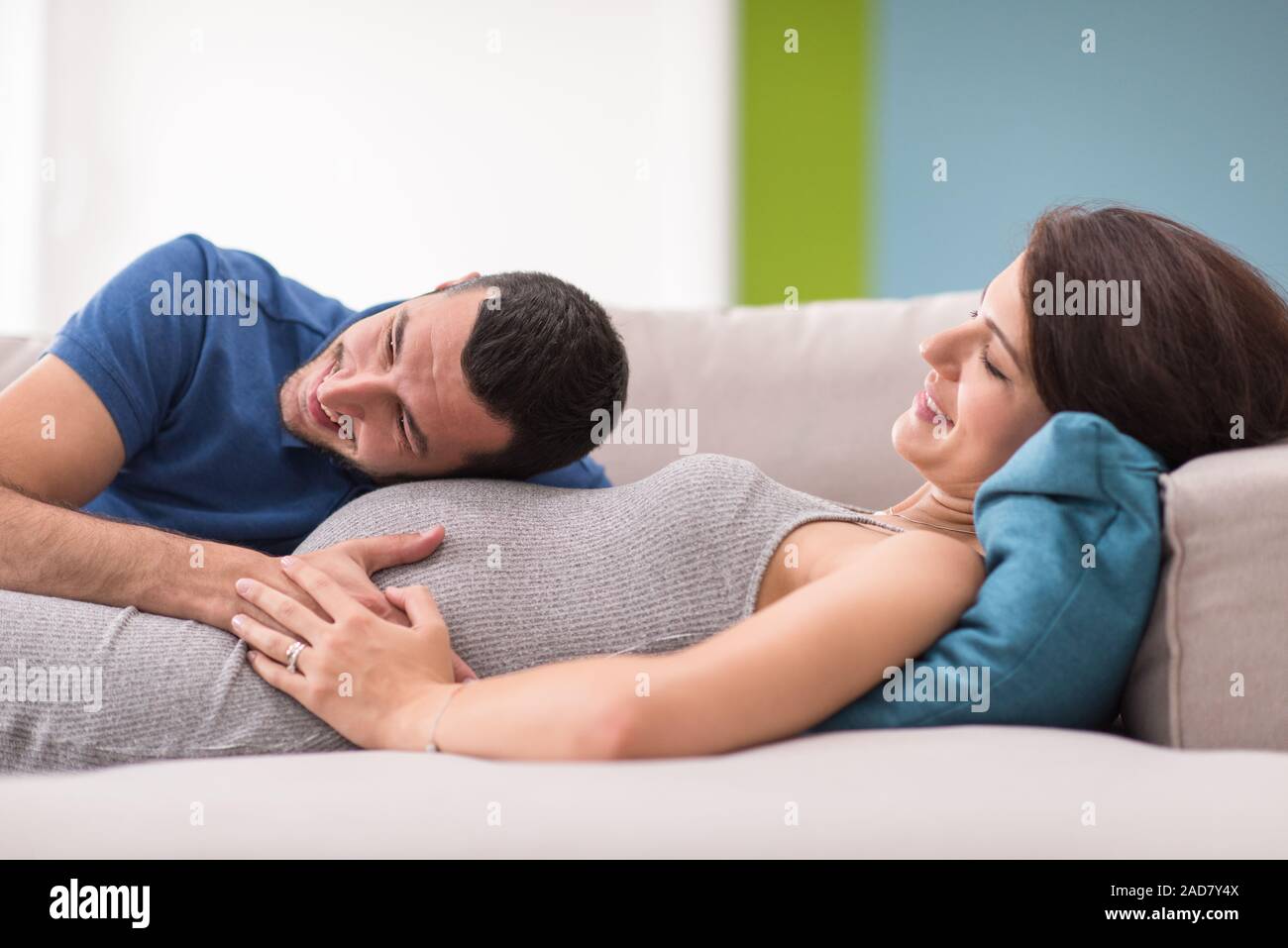 future dad listening the belly of his pregnant wife Stock Photo - Alamy