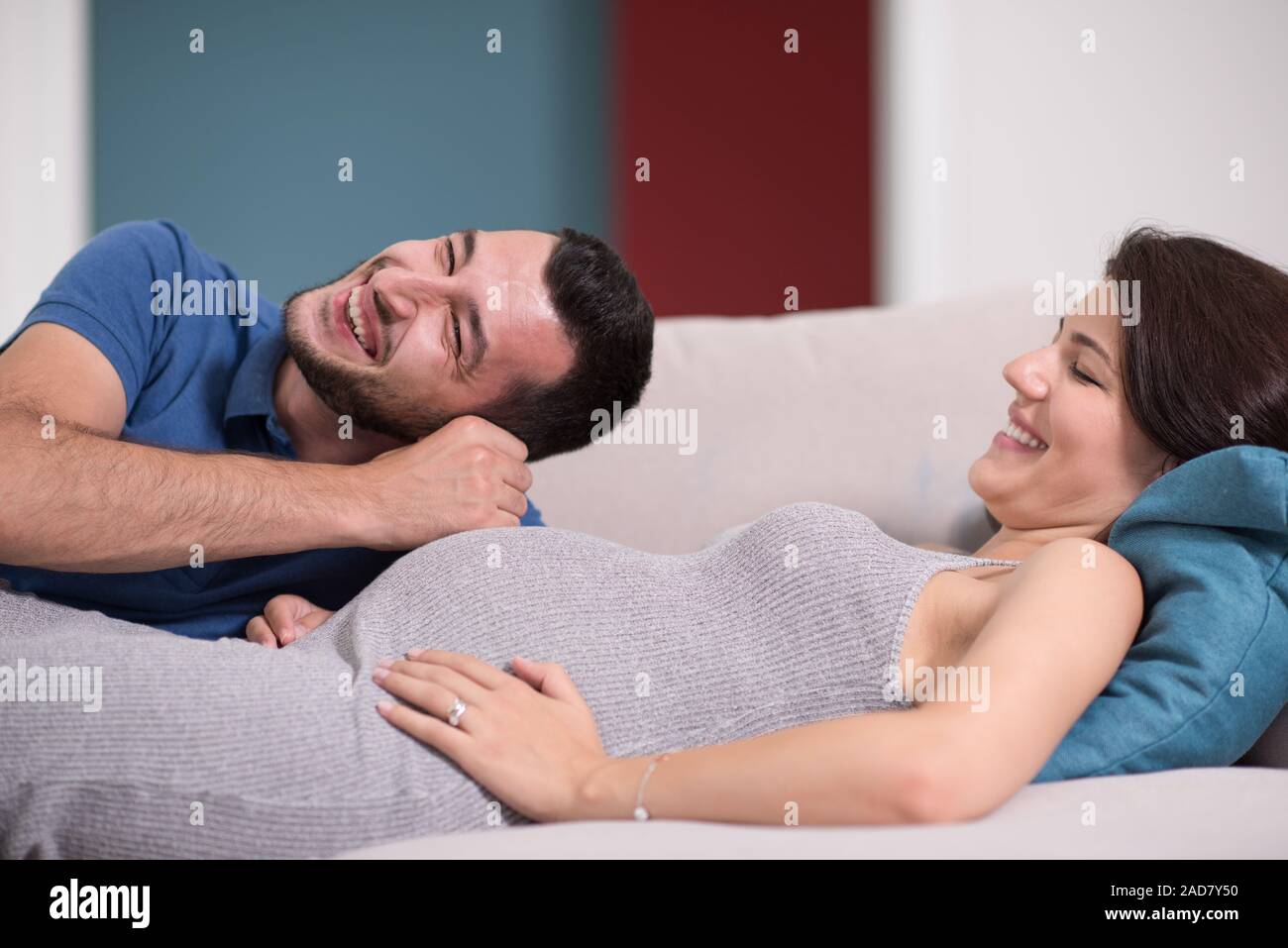 future dad listening the belly of his pregnant wife Stock Photo - Alamy