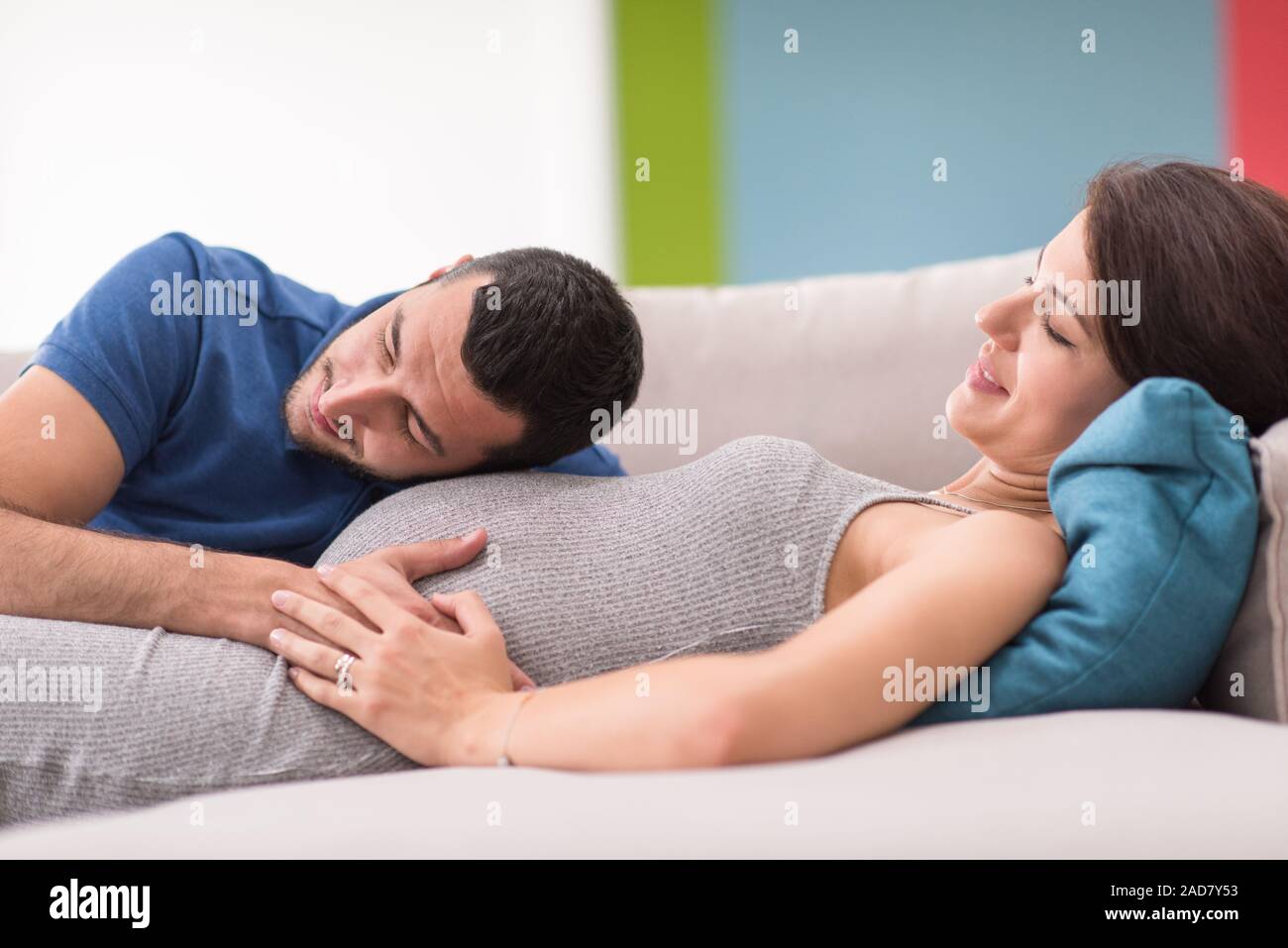 future dad listening the belly of his pregnant wife Stock Photo - Alamy