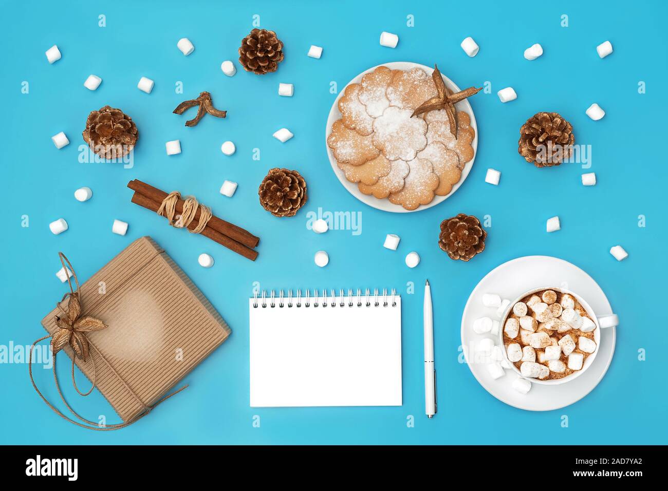 Notebook with isolated white page, hot chocolate with marshmallow ...