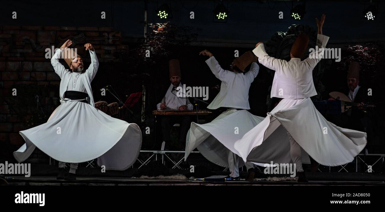 The Turkish whirling dancers or Sufi whirling dancers performing of the ...