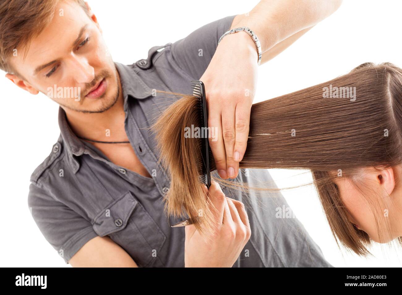 Professional hairdresser with long hair model, isolated on white Stock ...