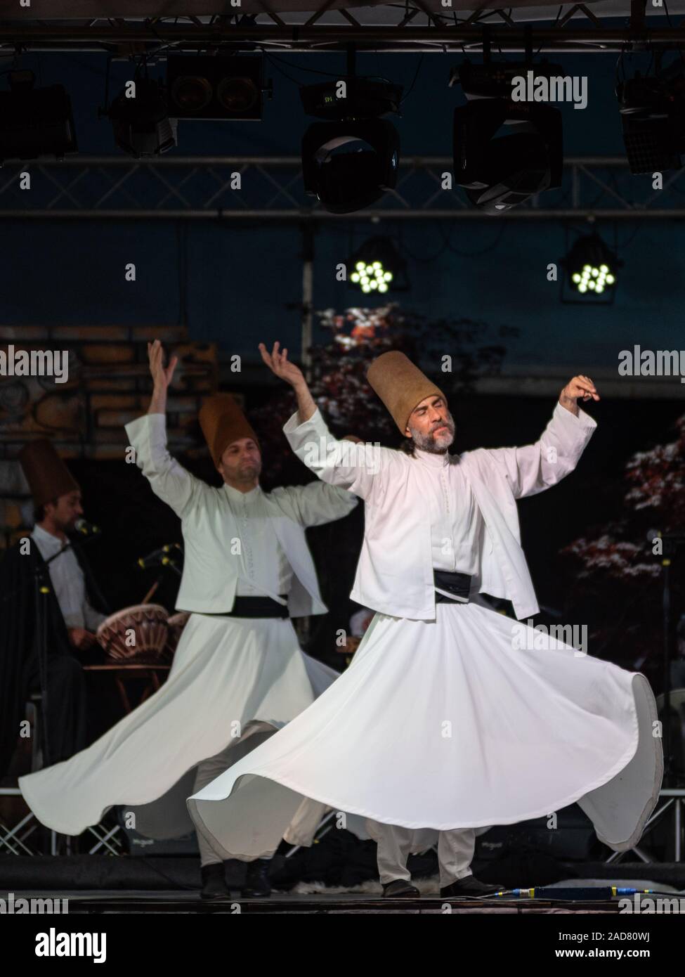 The Turkish whirling dancers or Sufi whirling dancers performing of the ...