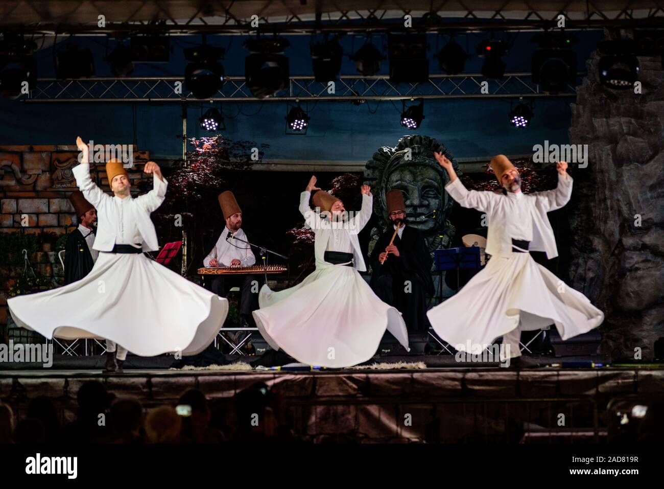 The Turkish whirling dancers or Sufi whirling dancers performing of the ...