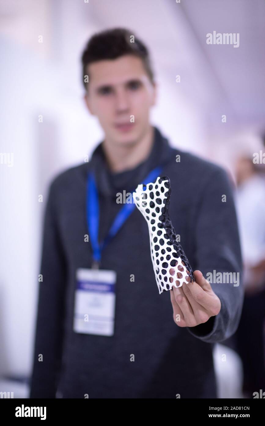 young engineer showing 3D printed model Stock Photo - Alamy