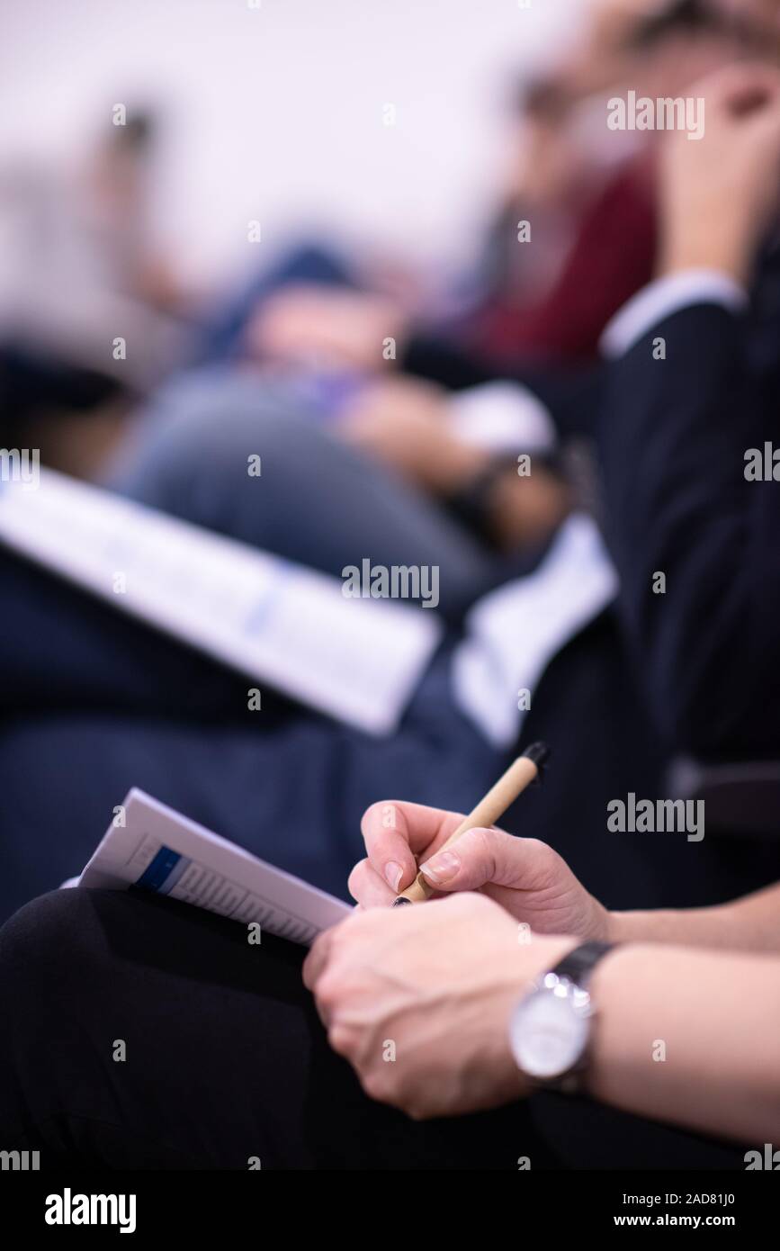 Business people taking notes Stock Photo - Alamy
