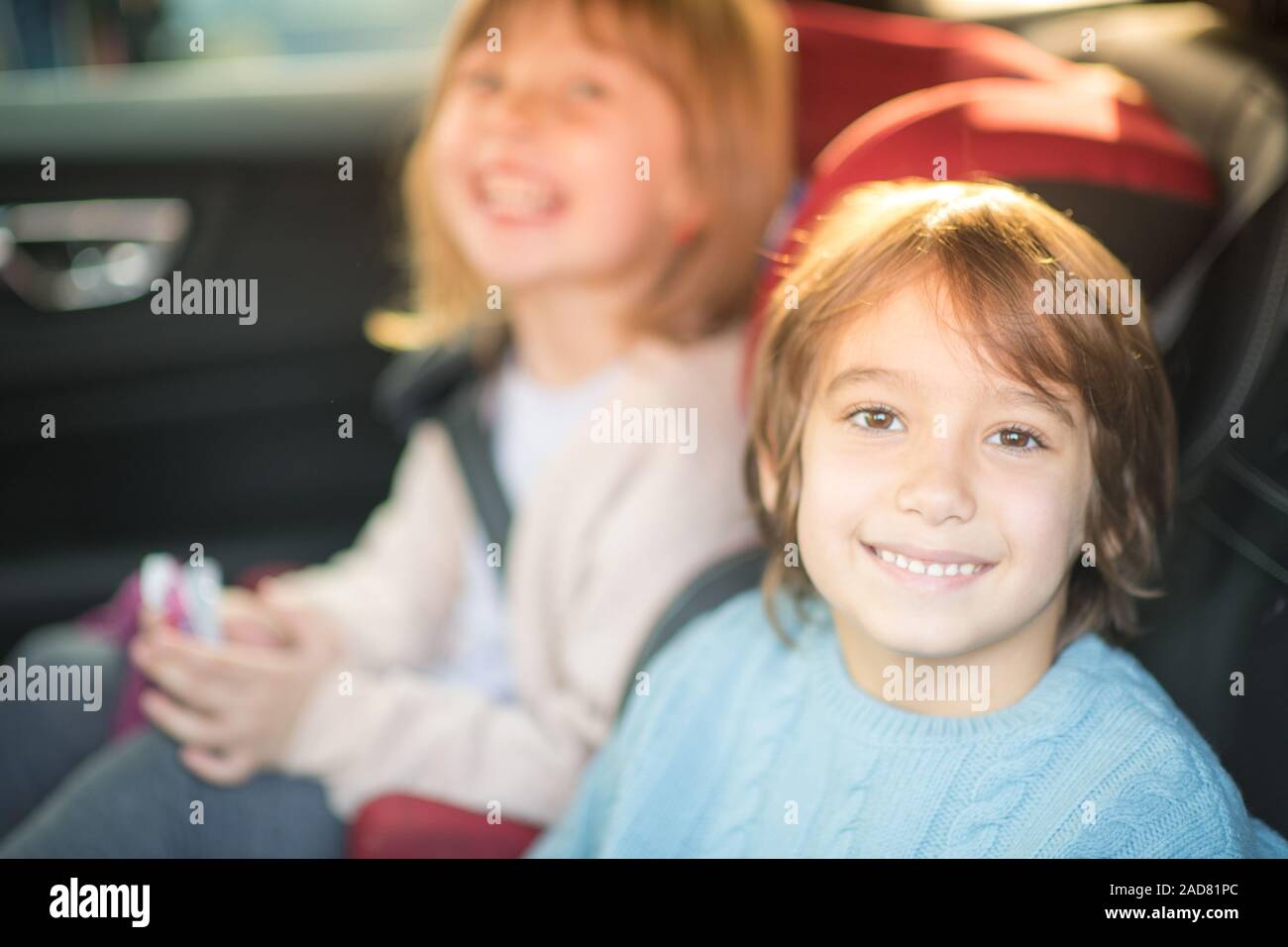 kids sitting together in modern car Stock Photo - Alamy