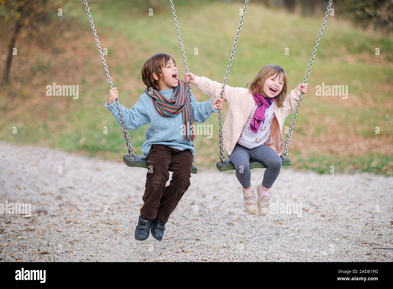 kids swing in the park Stock Photo - Alamy