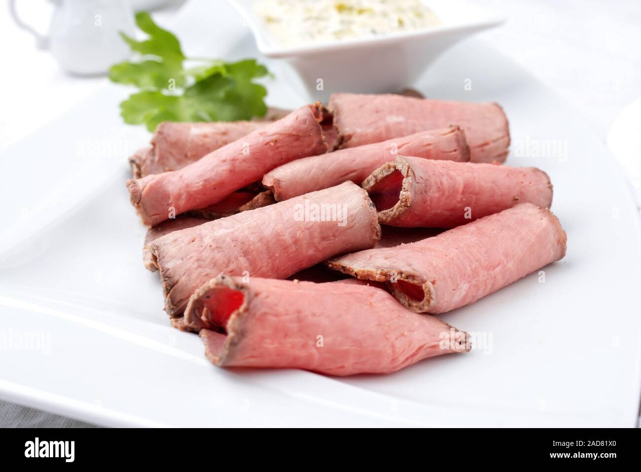 Traditional lunch meat with sliced cold cuts roast beef and remoulade ...