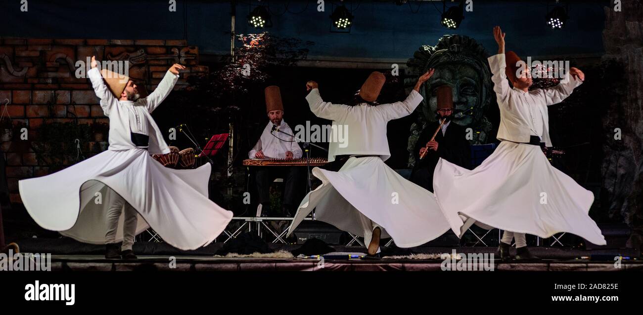 The Turkish whirling dancers or Sufi whirling dancers performing of the ...
