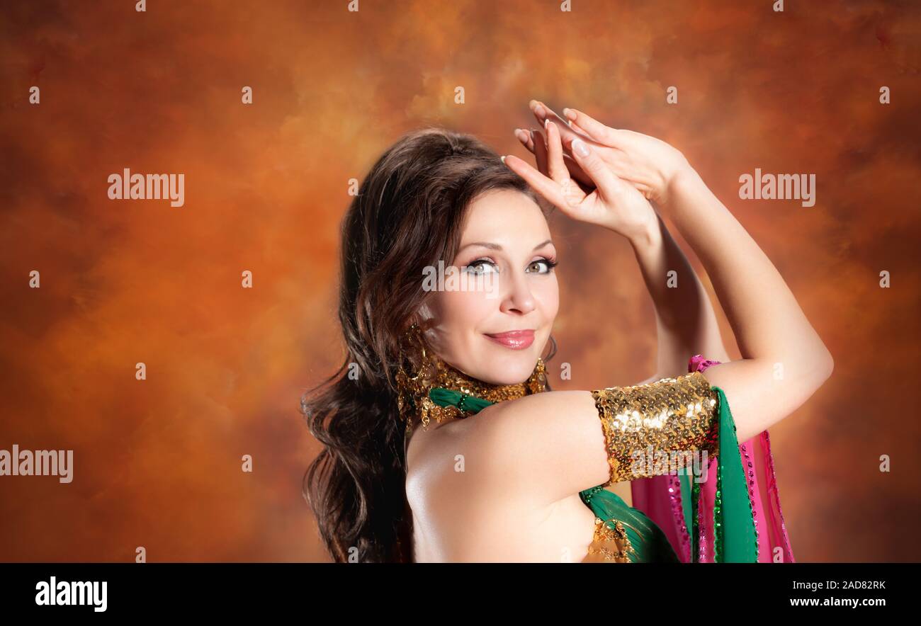 Gorgeous woman bellydancer dancing in traditional bellydance costume ...