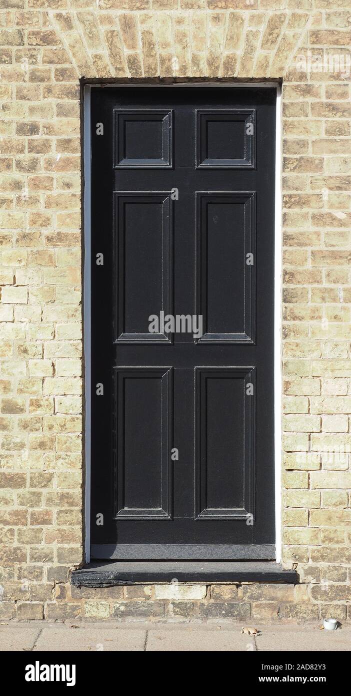 black traditional british door Stock Photo - Alamy