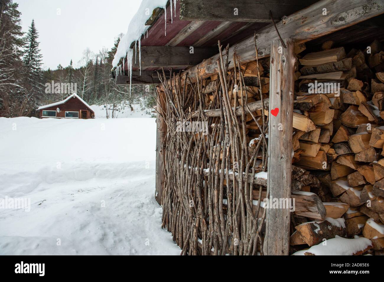 Stack of natural wood, with red heart Stock Photo - Alamy