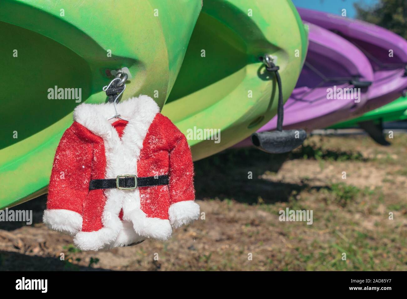 Christmas in Florida concept. Santa coat hangs off kayaks in Lake ...