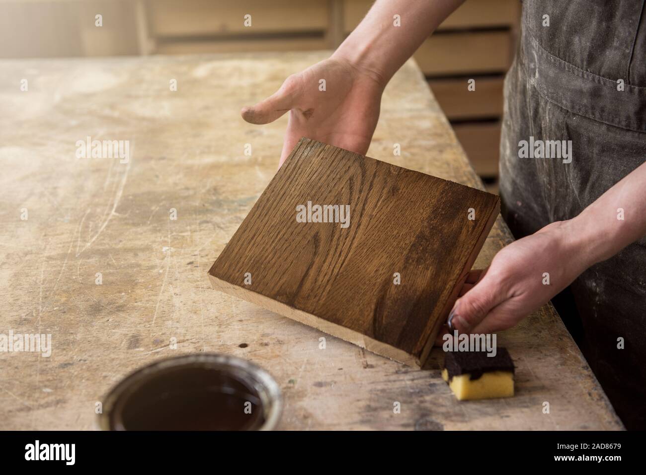 Carpenter painting wooden Stock Photo - Alamy