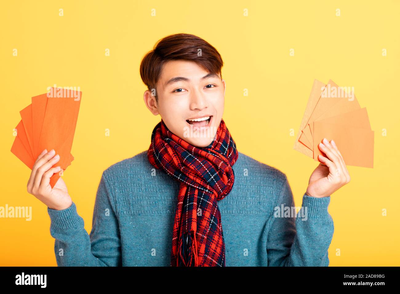 happy asian young man celebrating chinese new year Stock Photo - Alamy