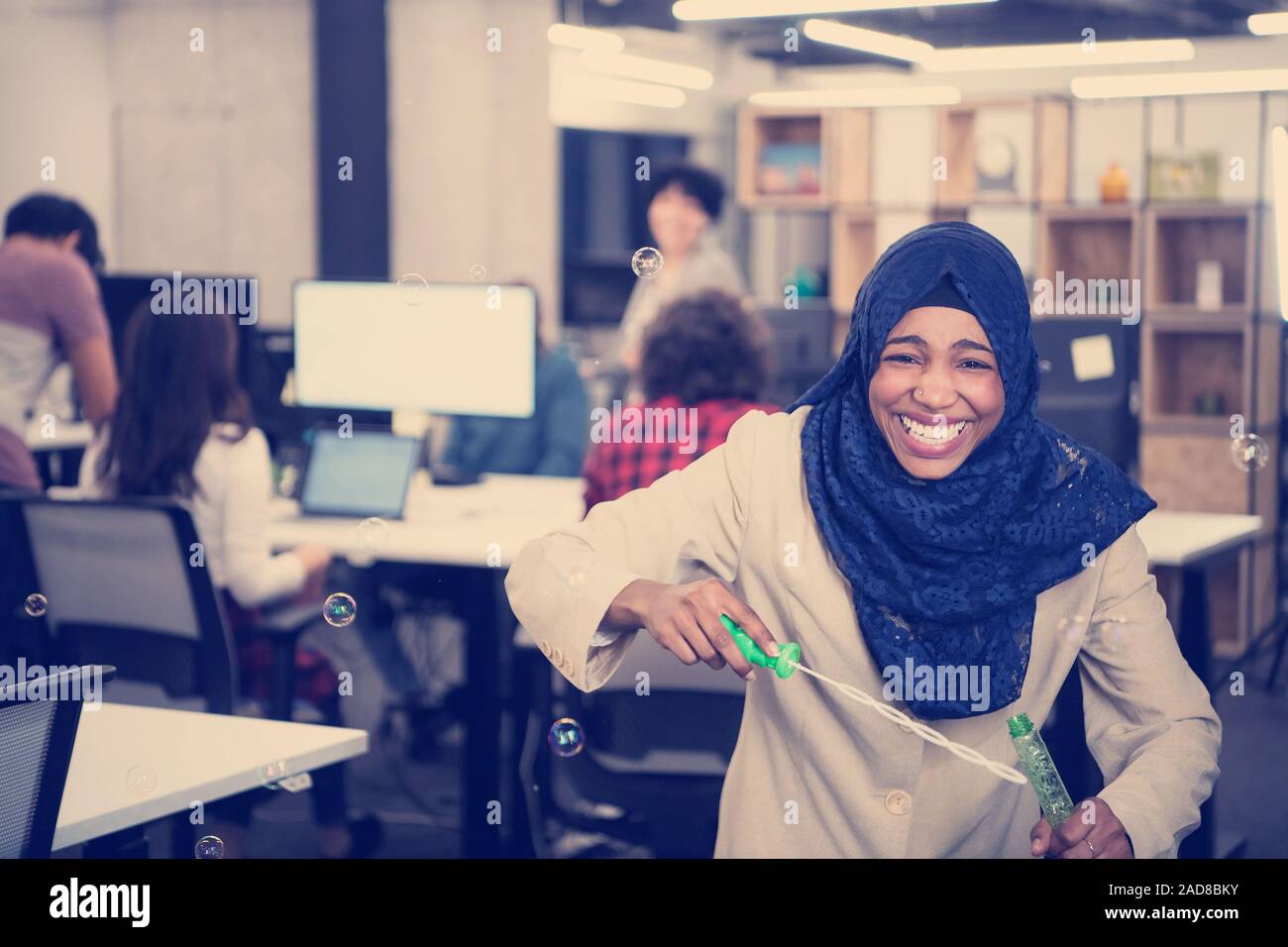 black muslim software developer making soap bubble Stock Photo - Alamy