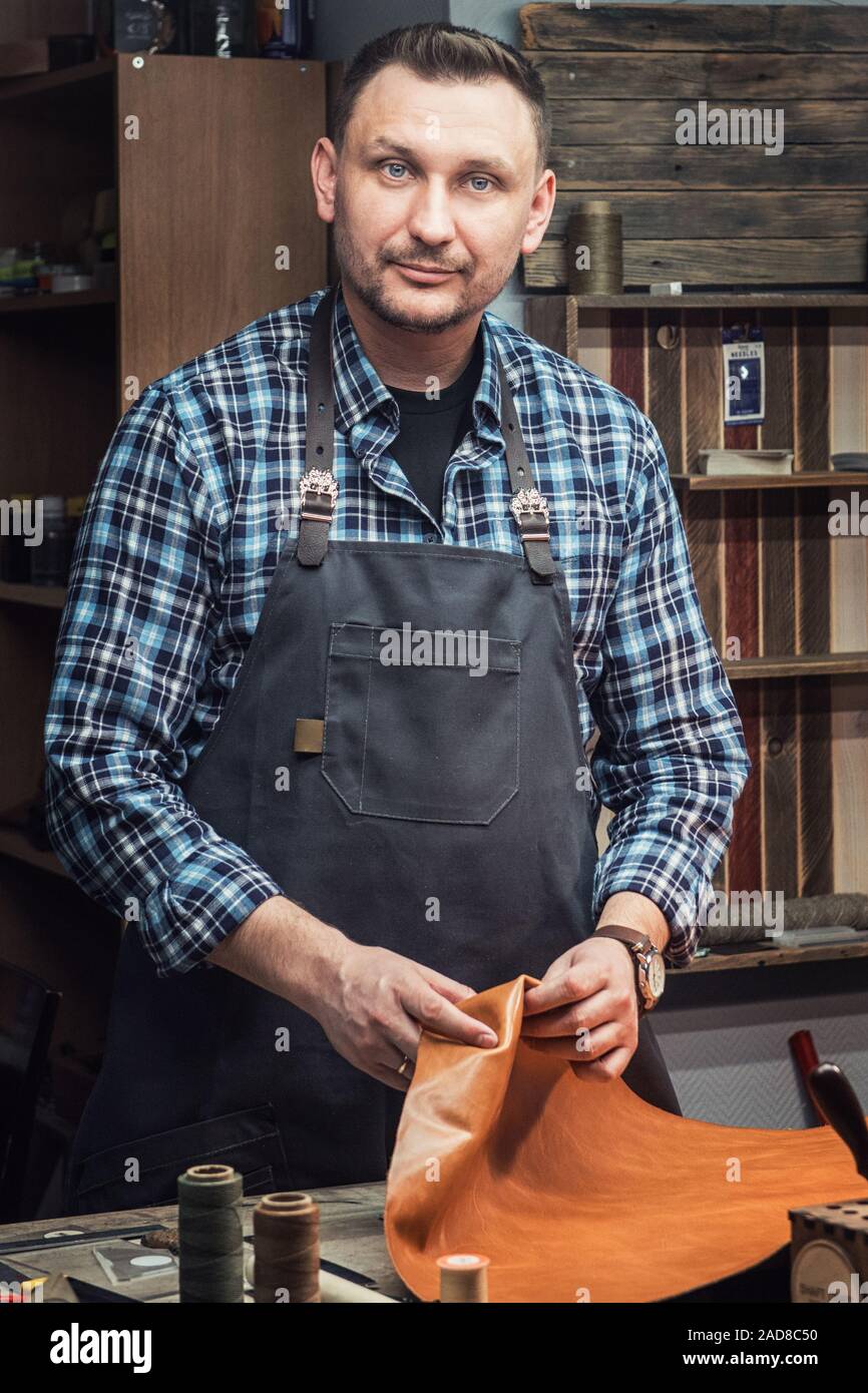 Concept of handmade craft production of leather goods Stock Photo - Alamy