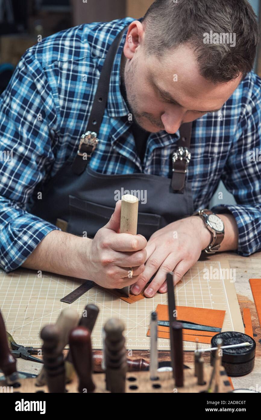 Concept of handmade craft production of leather goods Stock Photo - Alamy