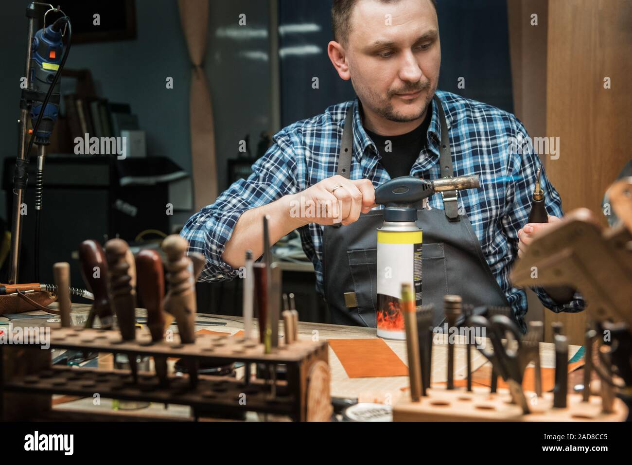 Concept of handmade craft production of leather goods Stock Photo - Alamy