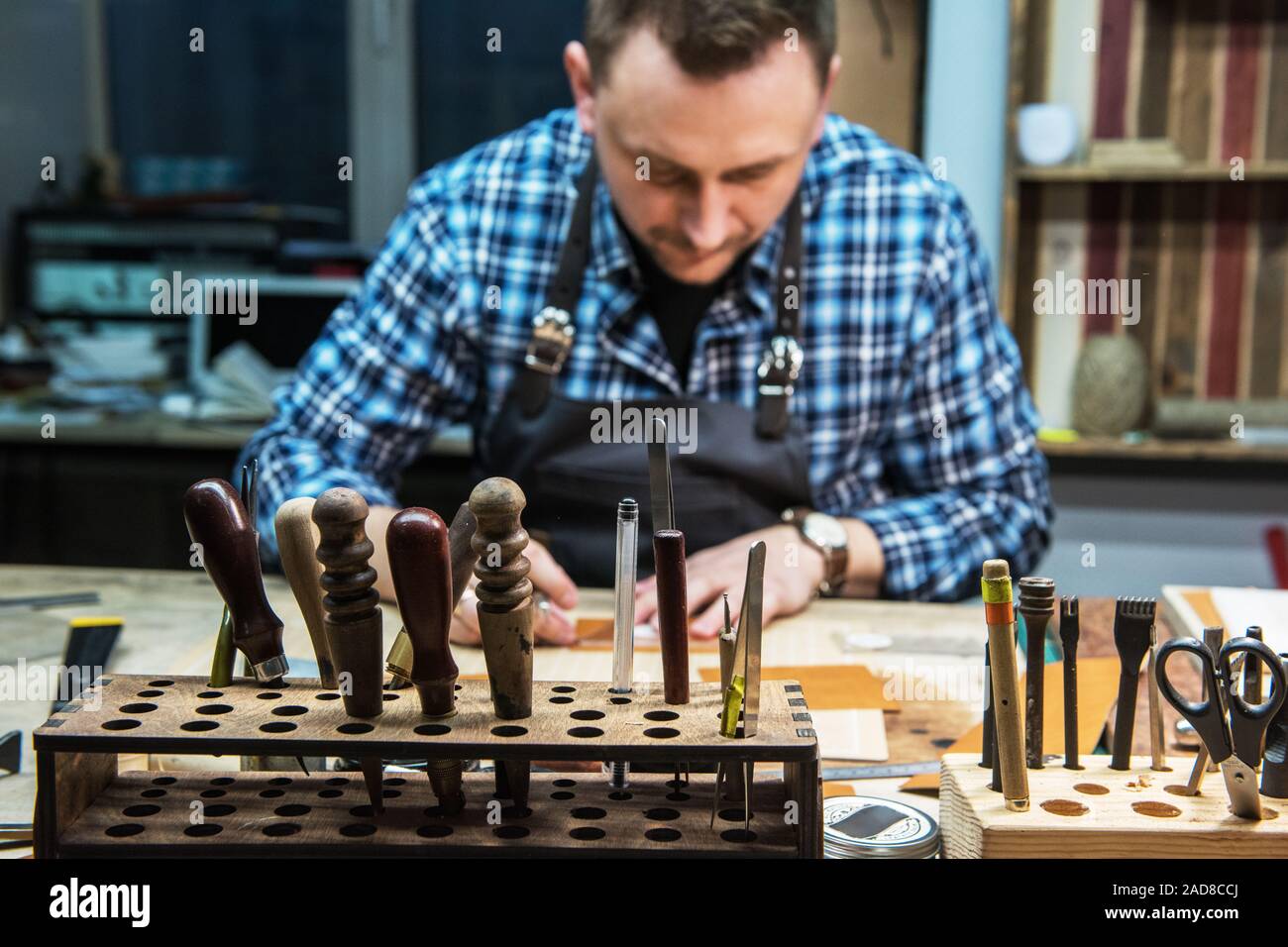 Concept of handmade craft production of leather goods Stock Photo - Alamy