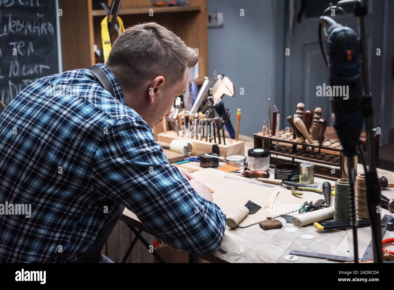 Concept of handmade craft production of leather goods Stock Photo - Alamy