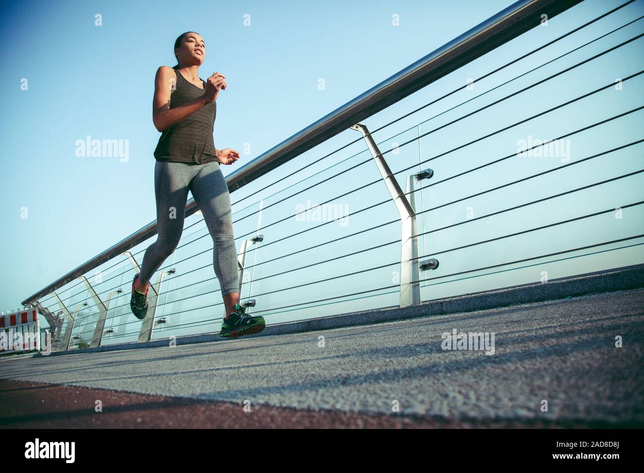 Exercise jogging determination bridge hi-res stock photography and ...