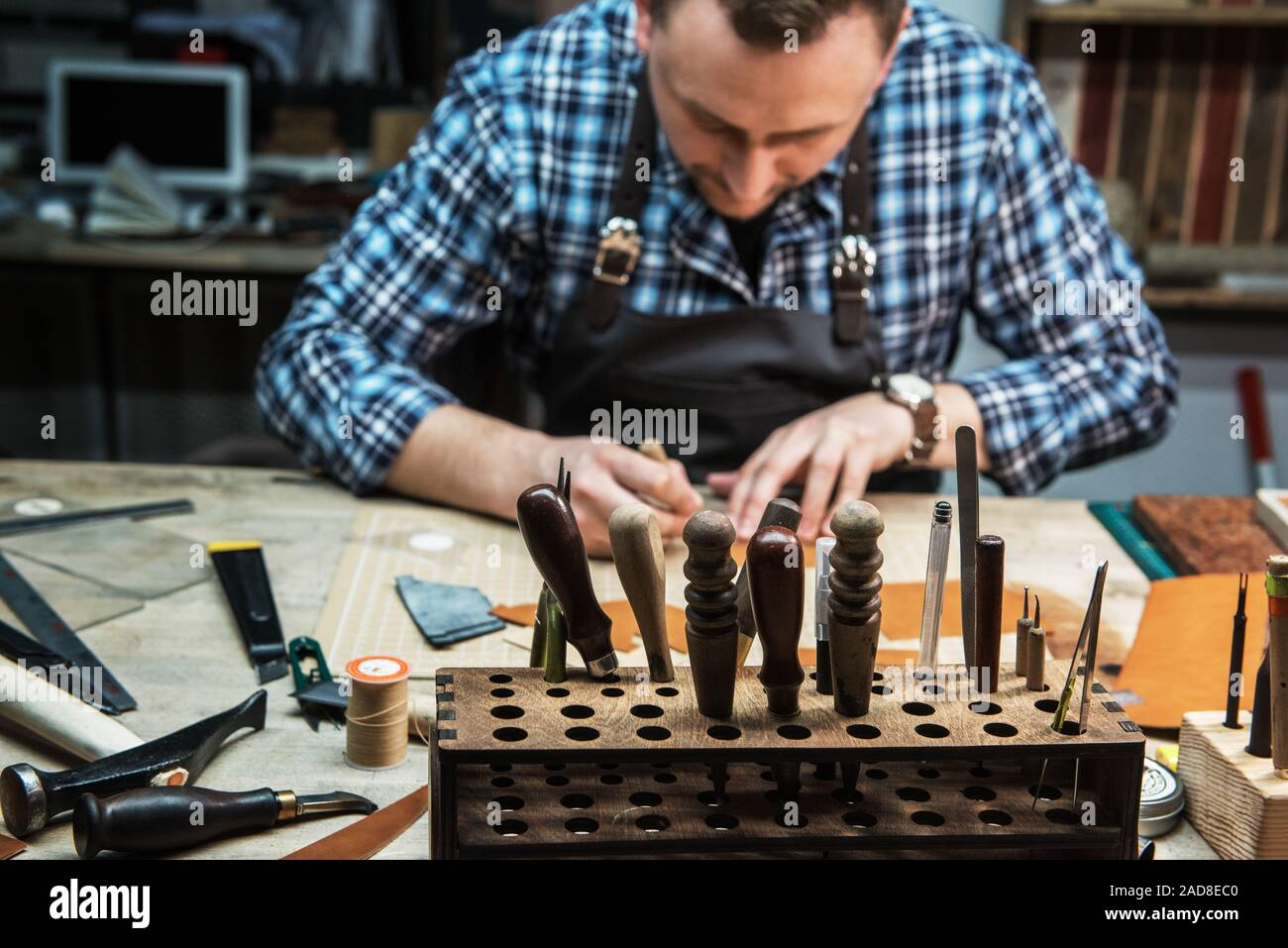 Concept of handmade craft production of leather goods Stock Photo - Alamy