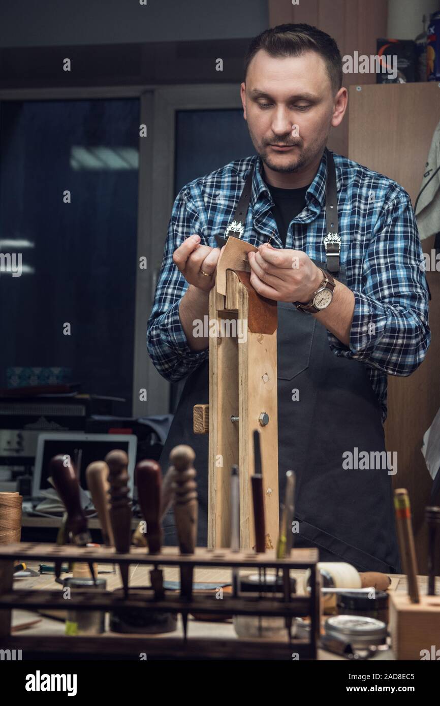 Concept of handmade craft production of leather goods Stock Photo - Alamy