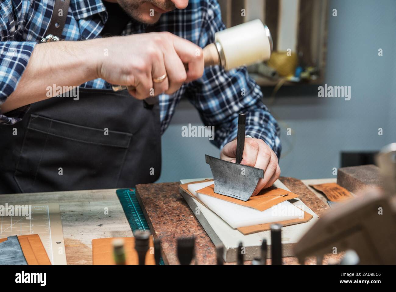 Concept of handmade craft production of leather goods Stock Photo - Alamy