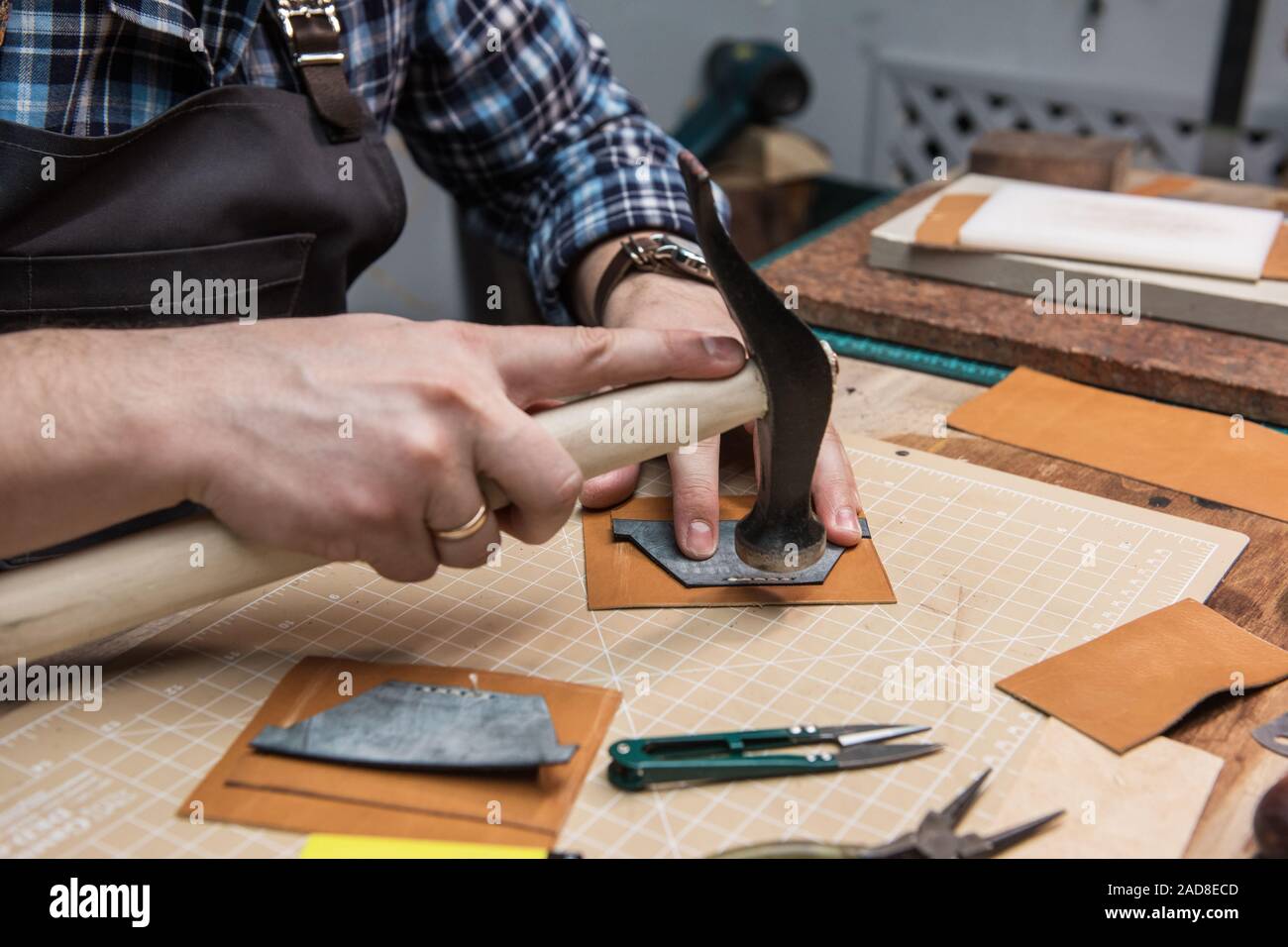 Concept of handmade craft production of leather goods Stock Photo - Alamy