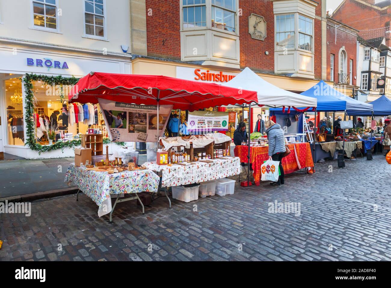 Pedestrianised shops shoppers street scene in winter high street hi-res ...
