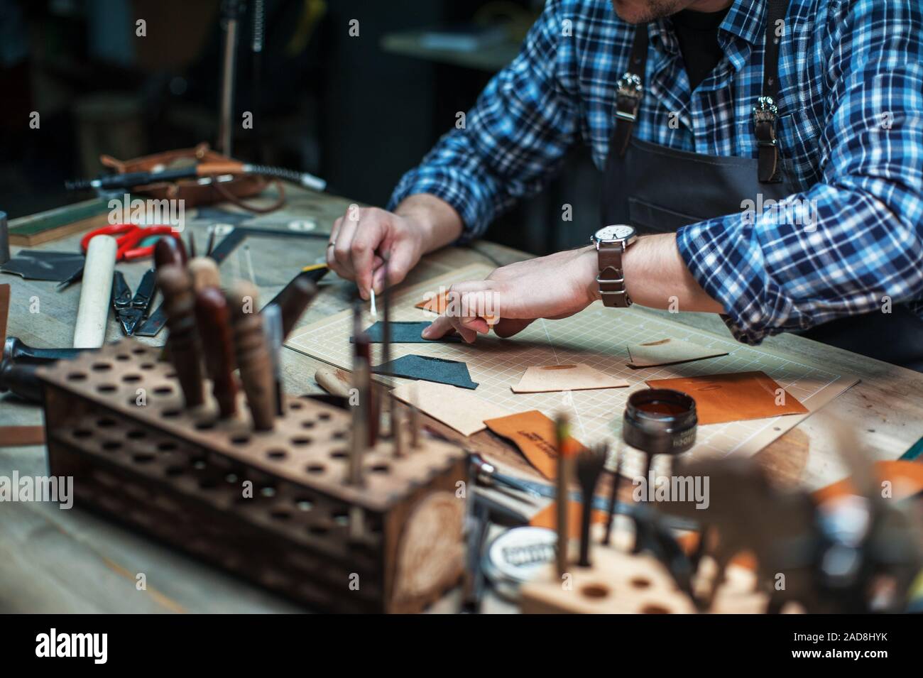 Concept of handmade craft production of leather goods Stock Photo - Alamy