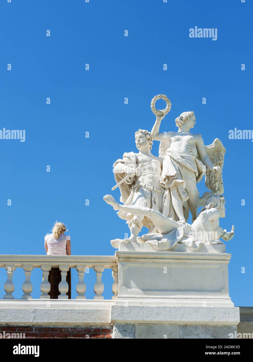 Baroque statue at a park with tourist woman Stock Photo - Alamy
