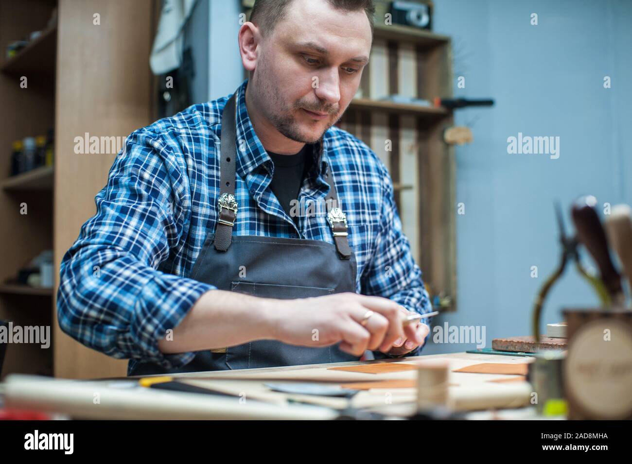 Concept of handmade craft production of leather goods Stock Photo - Alamy
