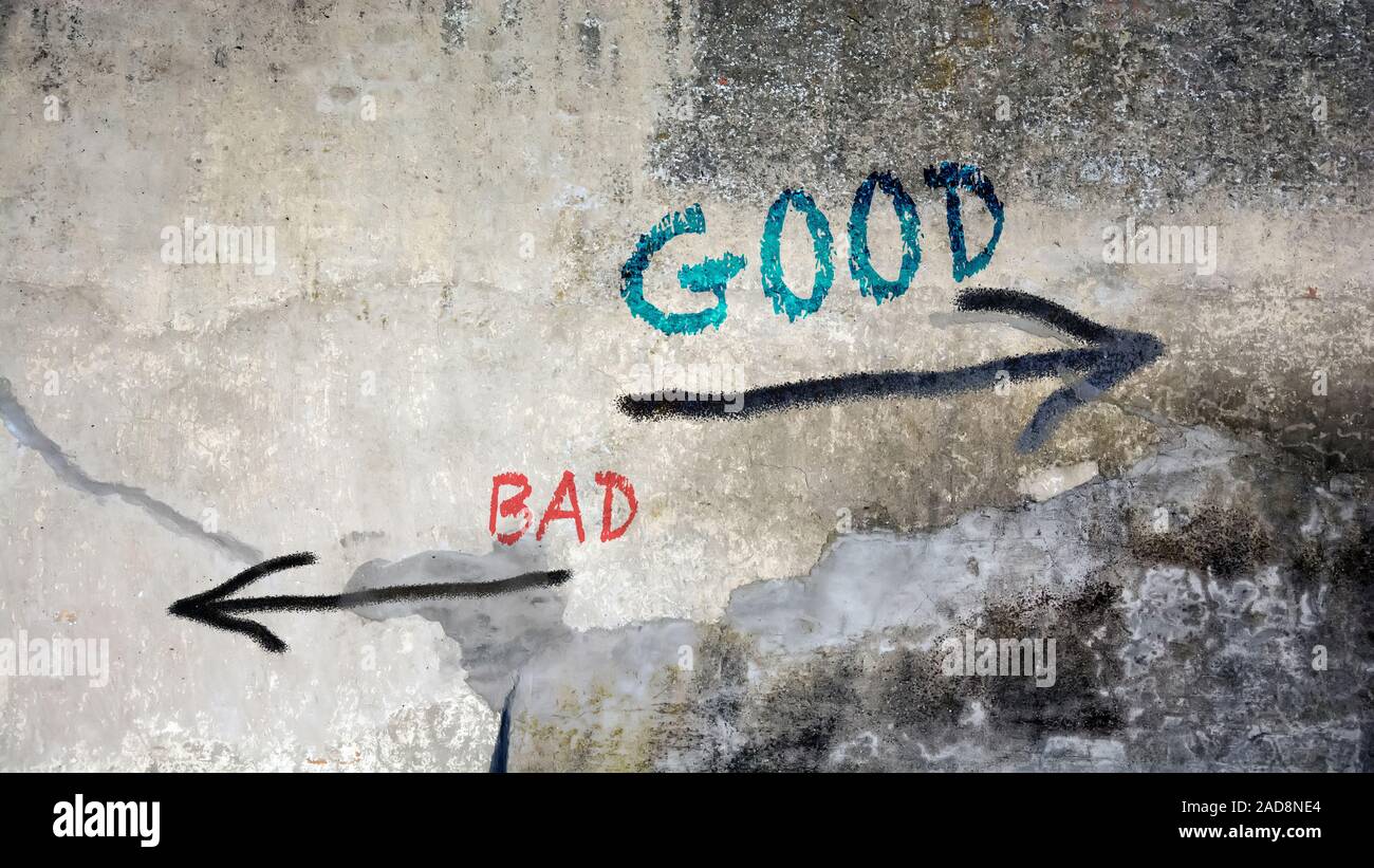 Wall Graffiti to Good versus Bad Stock Photo - Alamy