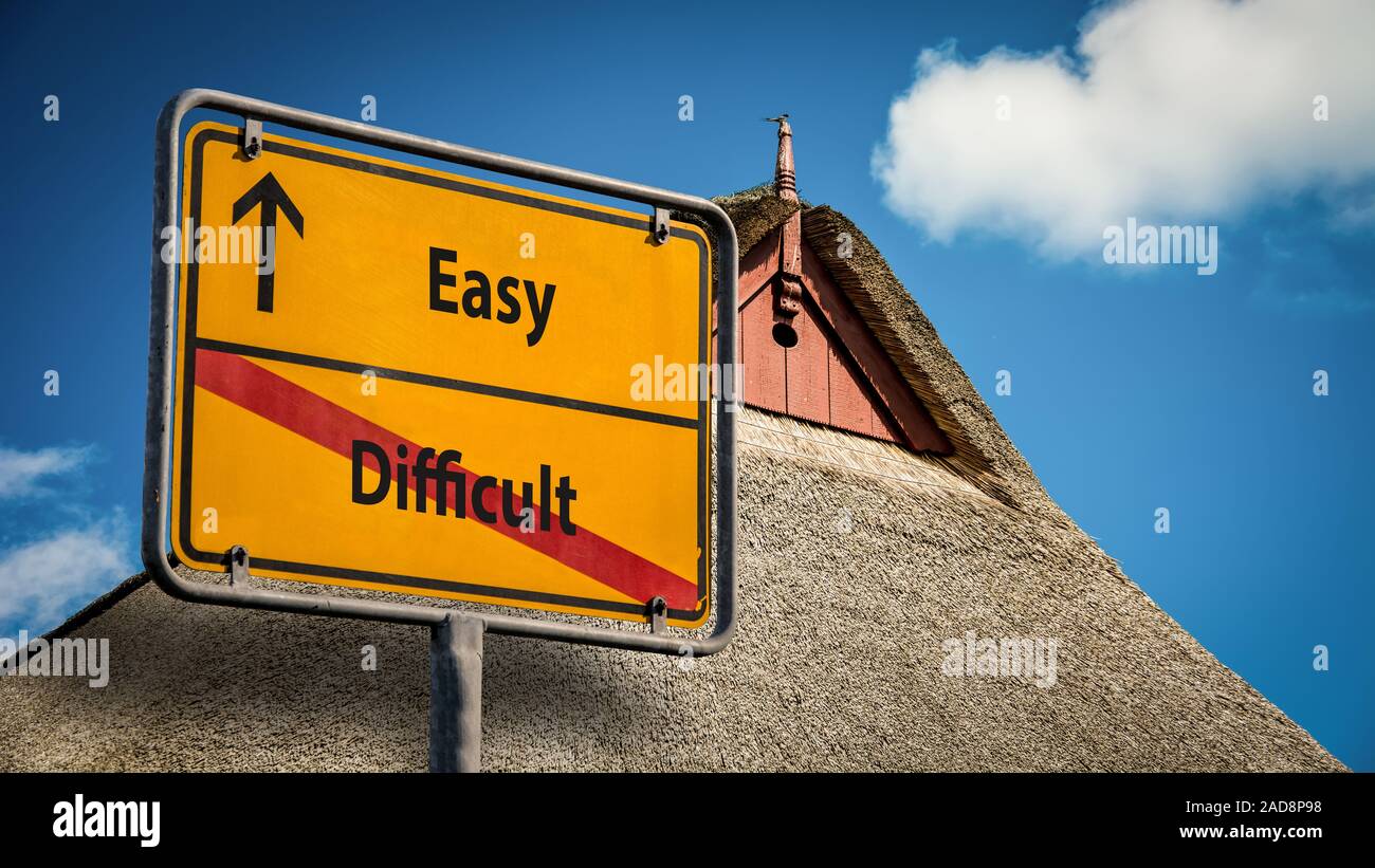 Street Sign to Easy versus Difficult Stock Photo - Alamy