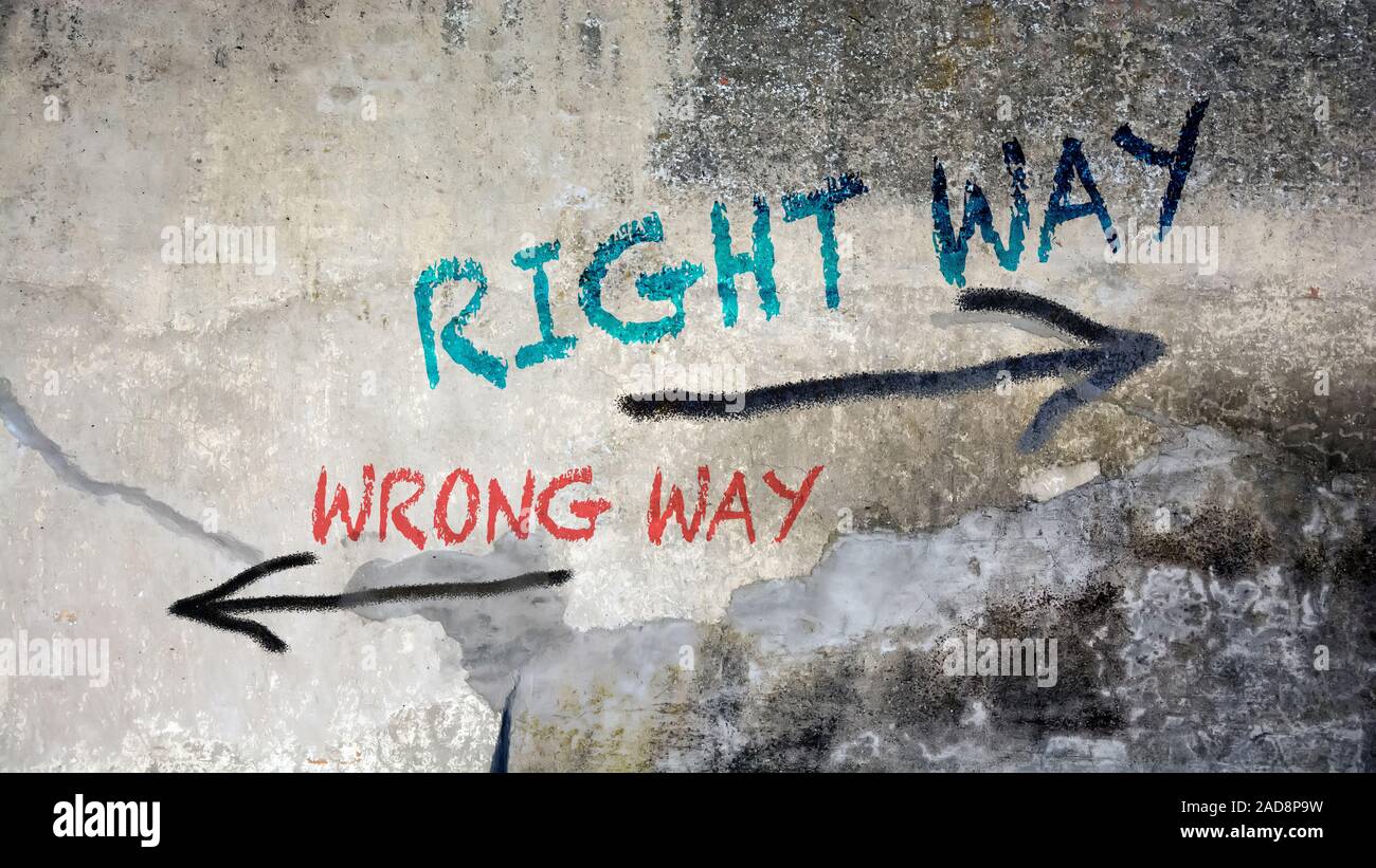 Wall Graffiti to RIGHT WAY versus WRONG WAY Stock Photo - Alamy