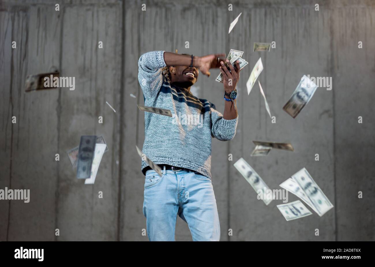 black Businessman making the rain of money Stock Photo - Alamy