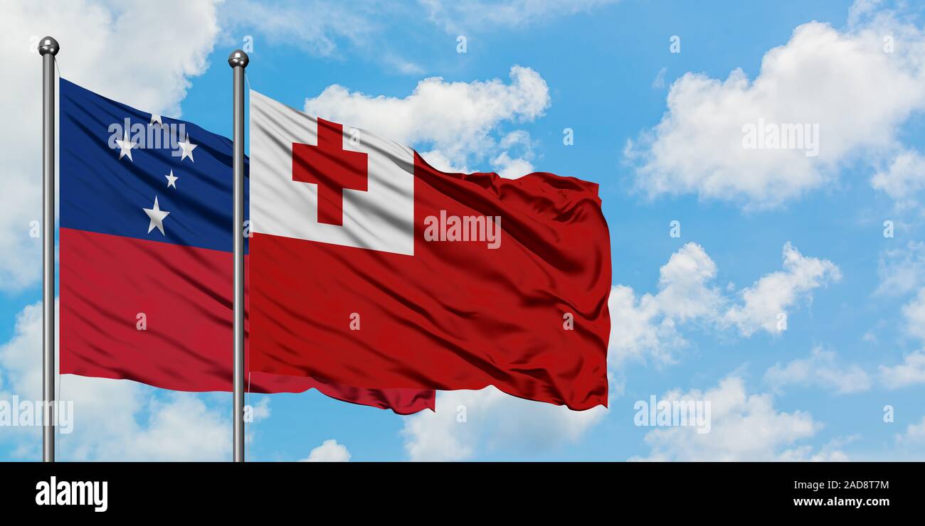 Samoa and Tonga flag waving in the wind against white cloudy blue sky ...