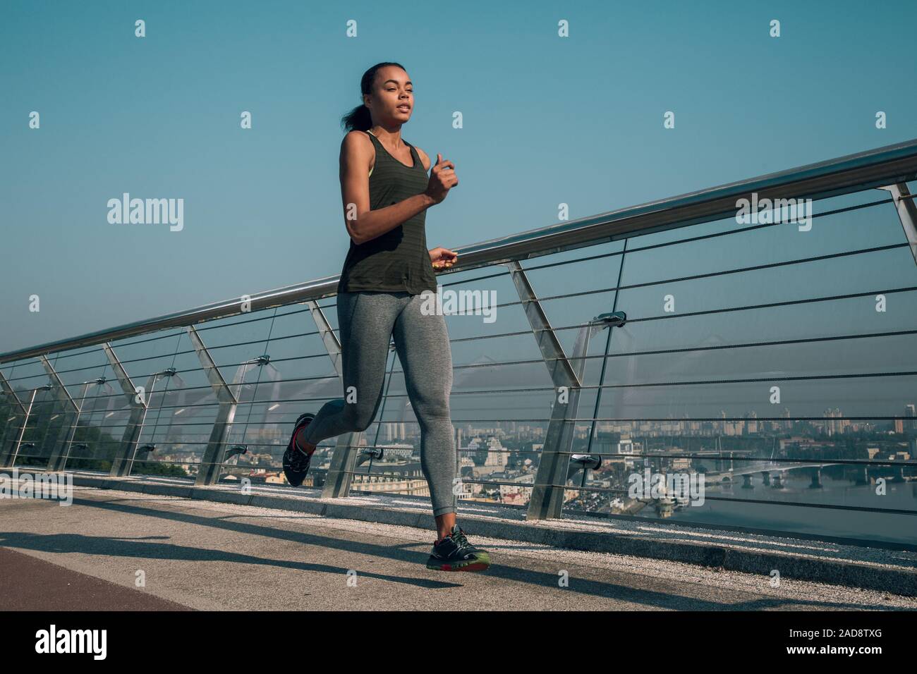 Healthy lady jogging outdoors alone stock photo Stock Photo - Alamy