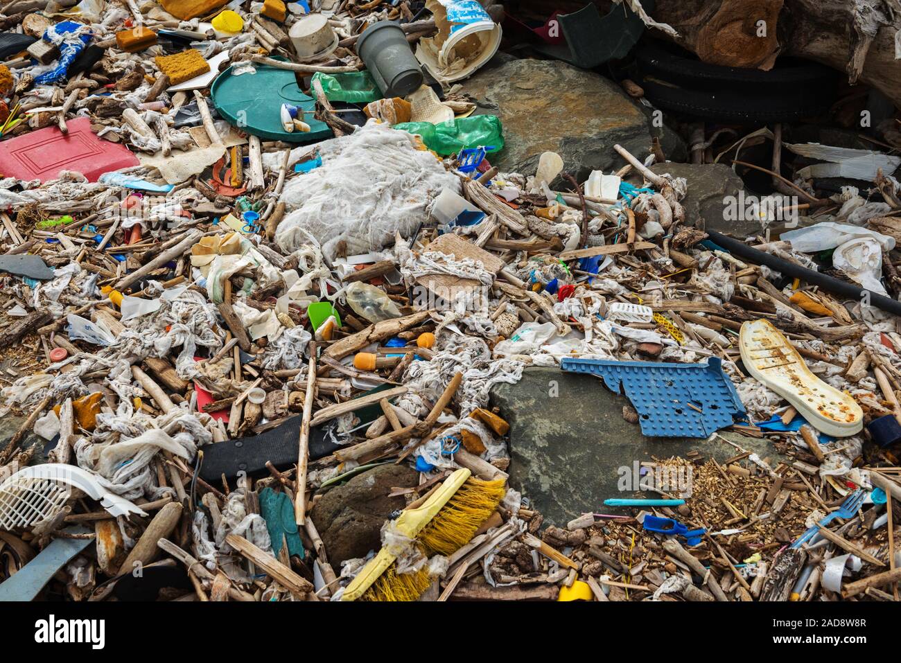 Spilled garbage on the beach near the big city. Empty used dirty ...