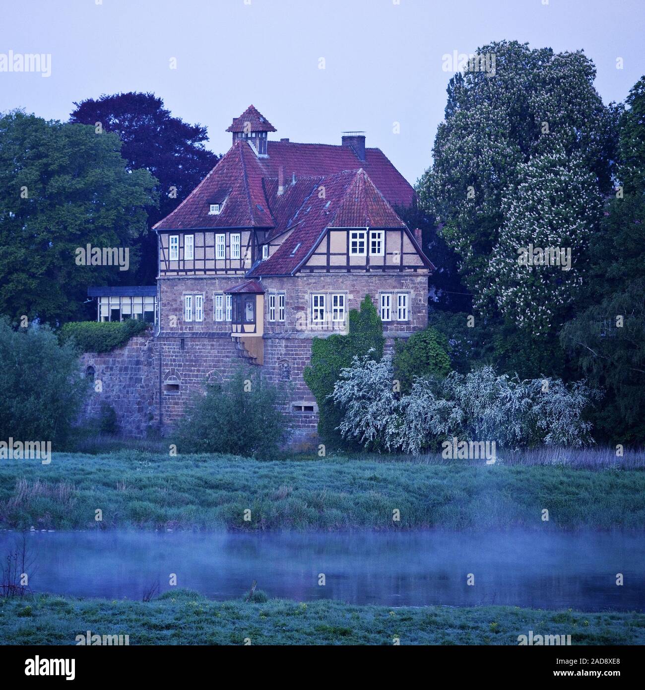Petershagen castle at the river Weser early in the morning, Petershagen ...