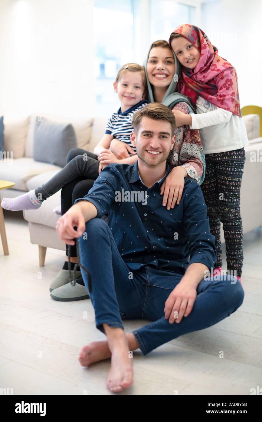 portrait of young happy modern muslim family Stock Photo - Alamy