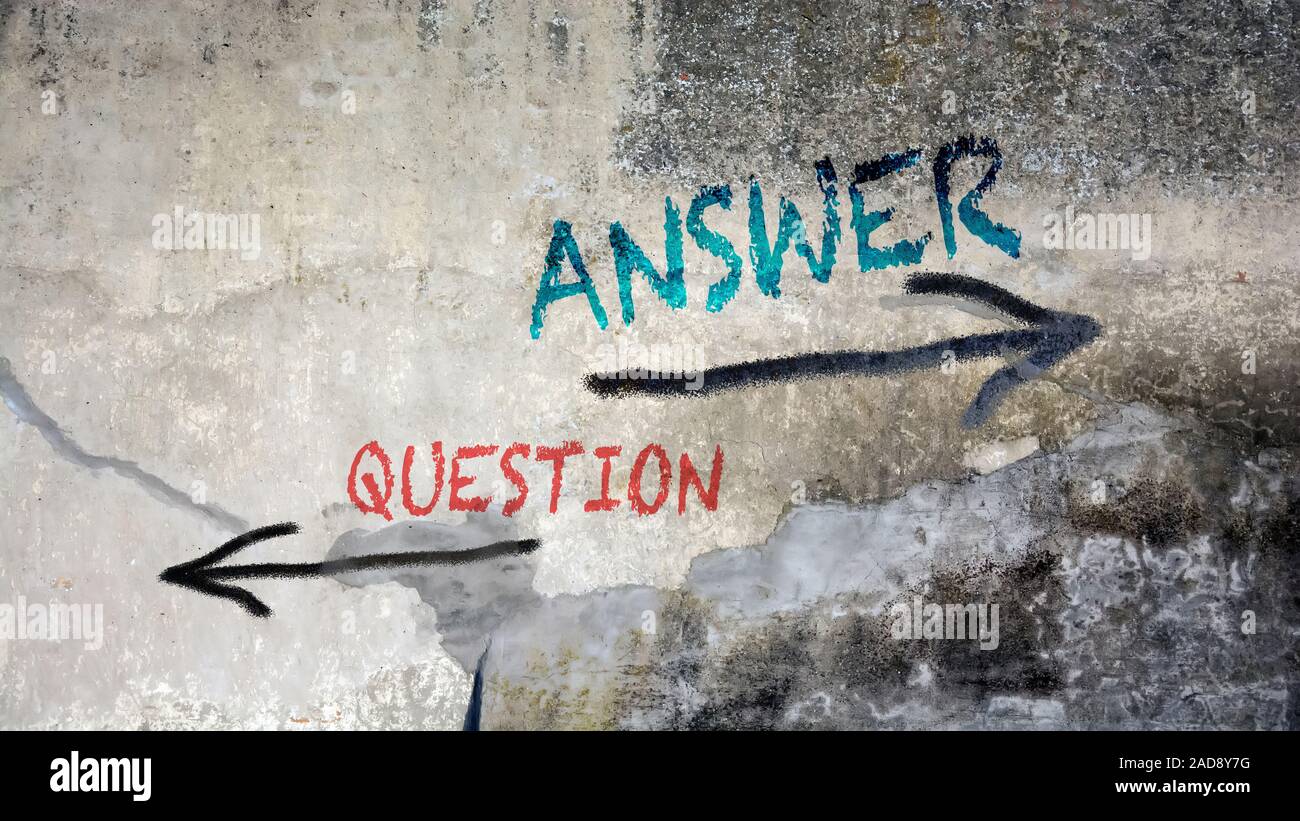 Wall Graffiti to Answer versus Question Stock Photo - Alamy